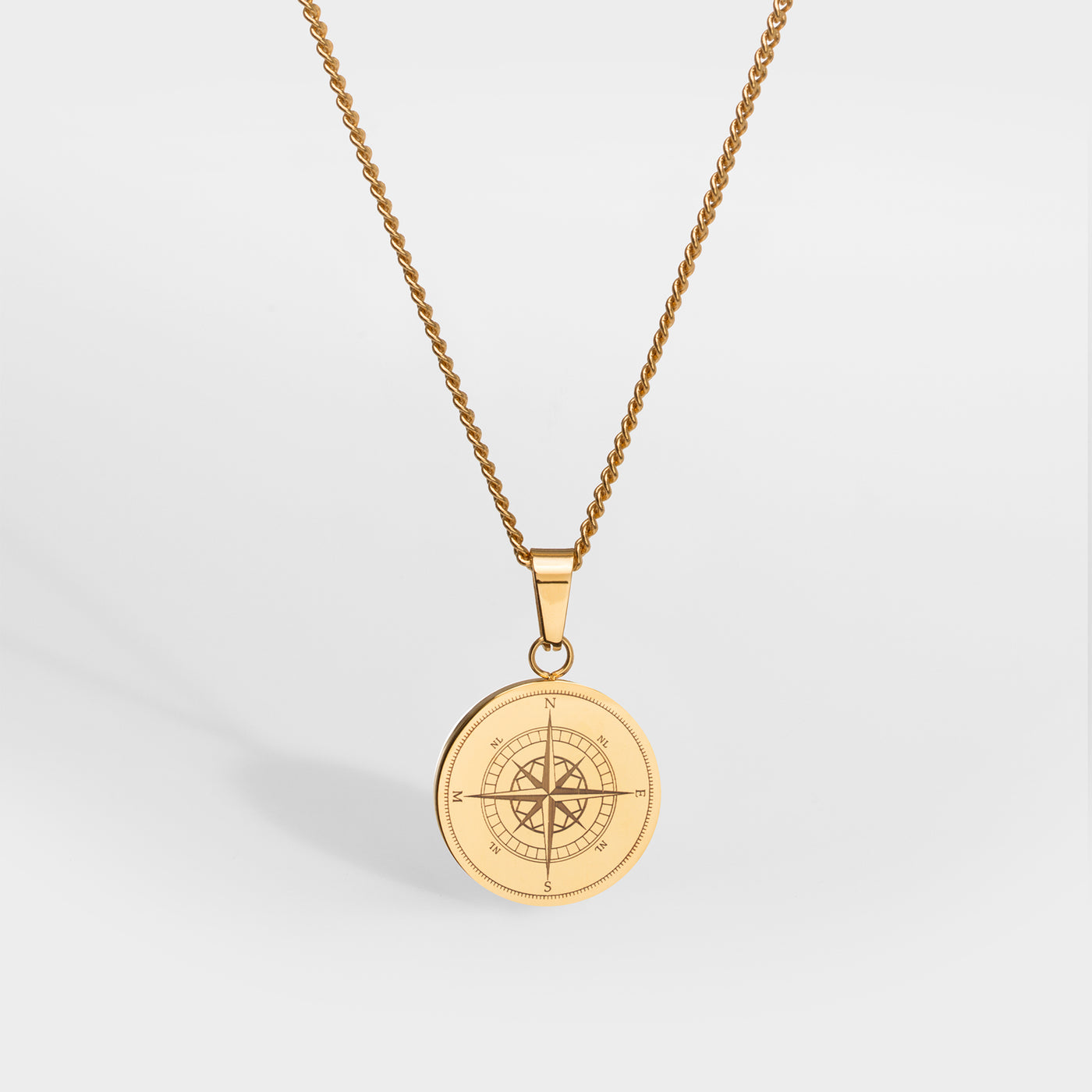 NL Compass necklace - Gold-toned necklace with compass pendant.